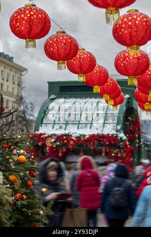 A street is decorated with lanterns and Chinese national flags during ...