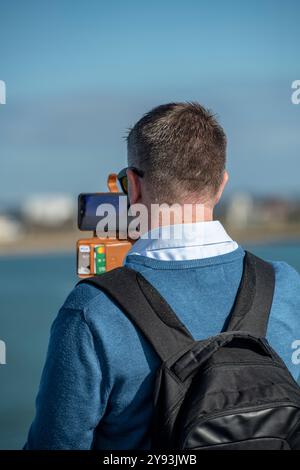 Man with wallet and credit cards using laptop in bedroom, closeup Stock ...
