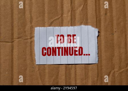To be continued message written on ripped torn paper with green ...