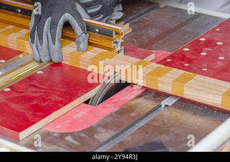 Circular saw cuts grooves in a board in a carpentry workshop Stock ...