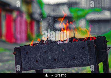 Hearth in a metal brazier. Lighting a fire for cooking barbecue Stock ...