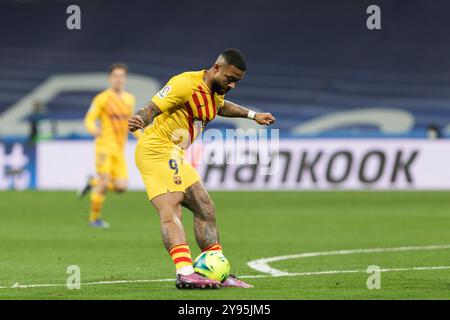 in action during the La Liga game between Real Sociedad and FC ...