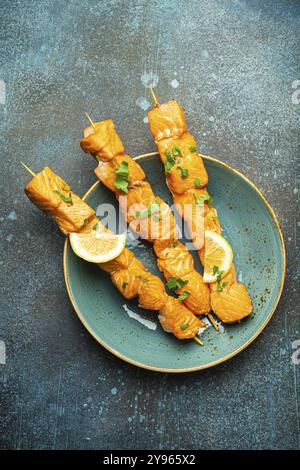 GRILLED FRUIT on a blue plate and white wooden background Stock Photo ...