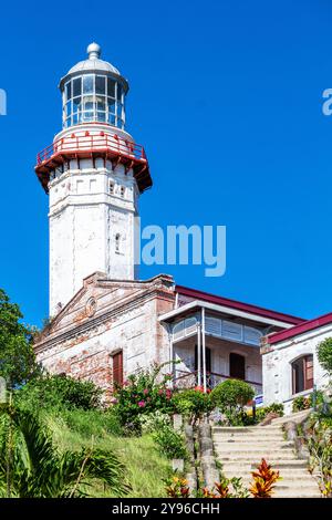 Cape Bojeador Lighthouse stands atop a hill in Ilocos, Philippines ...