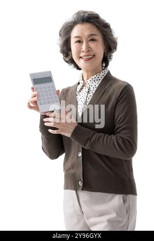 Happy senior woman presenting calculator Stock Photo - Alamy