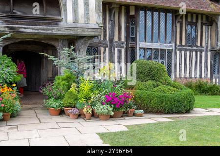 Display of Autumn plant pots at the entrance of Great Dixter House ...