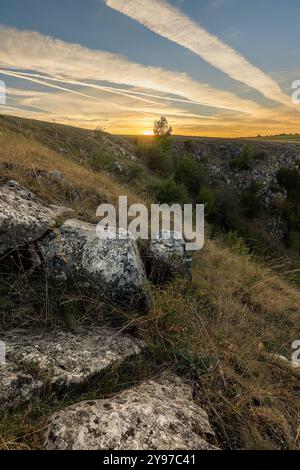 Sunset in Romania Sunset over serene waters reflects golden hues and ...