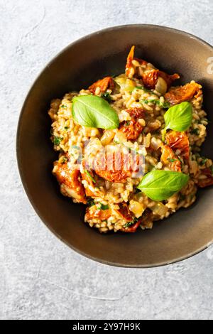 Sun-dried tomato risotto with basil Stock Photo - Alamy