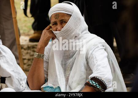 An Ethiopian woman, a member of the Beta Israel Jewish community, prays ...