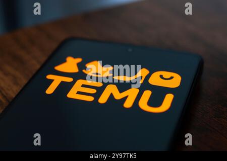 In this photo illustration, a Temu logo seen displayed on a smartphone ...