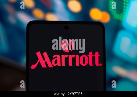In this photo illustration, the Marriott logo is displayed on a ...
