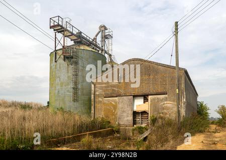 Grain storage silos and asbestos barn in farmyard, Alderton, Suffolk ...