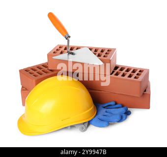 Red construction bricks safety gloves claw hammer on concrete ...