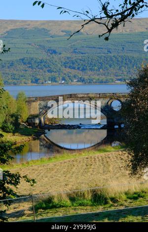 Scottish castle and arched road bridge Stock Photo - Alamy