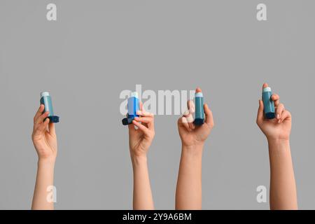 Modern inhalers on grey background Stock Photo - Alamy