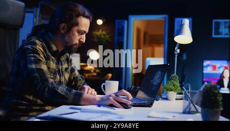 Self employed developer updating artificial intelligence machine ...