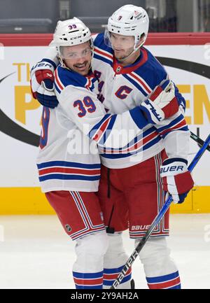 New York Rangers' Sam Carrick, left, and Edmonton Oilers' Troy Stecher ...