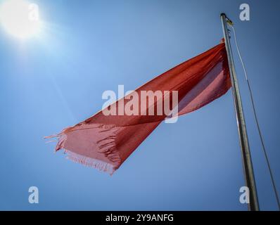 Red flag warning of dangerous currents at the sandy beach at West ...