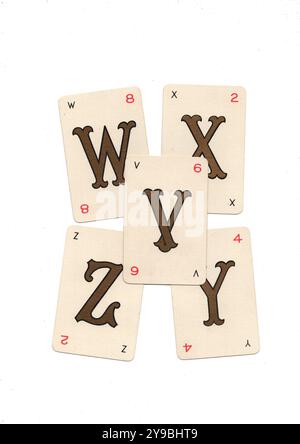 A montage of vintage playing cards with ornate capital letters from the ...