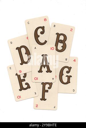 A montage of vintage playing cards with ornate capital letters on a ...