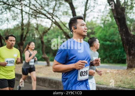 group of asian participating on marathon event Stock Photo - Alamy