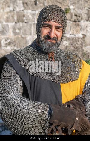 A member of the Rhodes Medieval Rose Association Knights' Swords Team ...