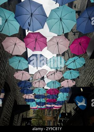 Colorful umbrella against the cloudy sky Stock Photo - Alamy