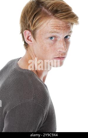 Proud young redhead man in glasses holding hand on heart, listening ...