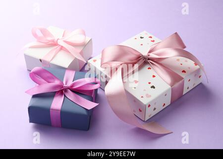 Gift boxes with beautiful bows and hearts isolated on white background ...