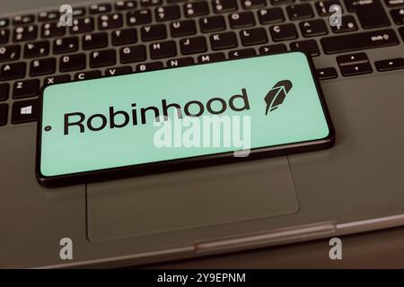 In this photo illustration a Robinhood logo is seen on a smartphone ...