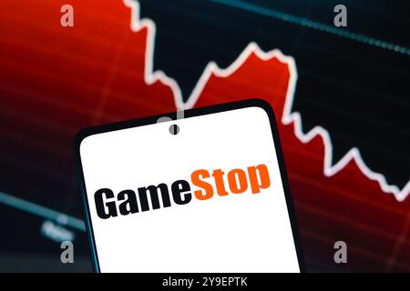 In this photo illustration a GameStop logo is seen displayed on a ...