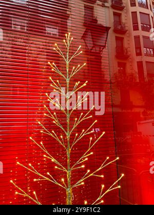 Window reflection of Christmas tree decoration at night Stock Photo - Alamy