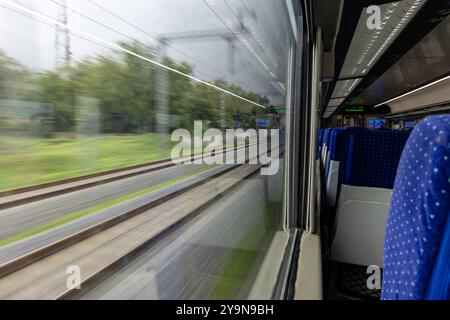 Passenger Train Window View During Daytime with motion blur Stock Photo ...