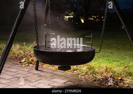Smoke rising from a hanging fire pit Stock Photo - Alamy