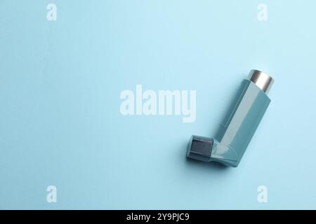 Asthma inhaler on light blue background, top view. Space for text Stock ...