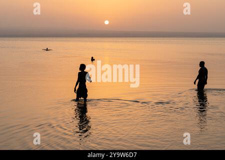 Workers from the salt mining industry washing and swimming in lake ...