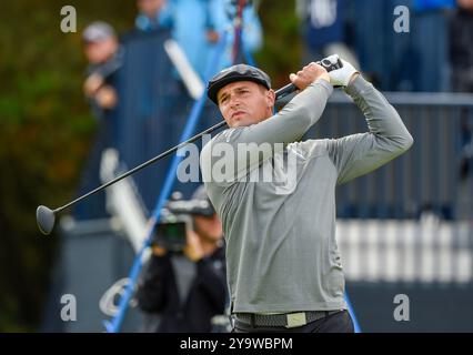 Bryson DeChambeau tees off on the 12th hole during the first round of ...