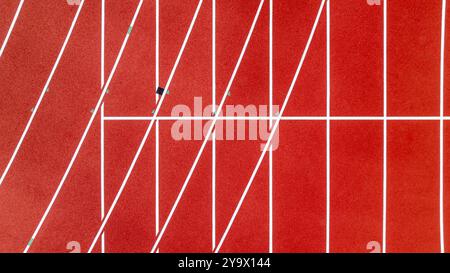 Aerial image of a new red running track lane numbers, 1 through 8, with ...