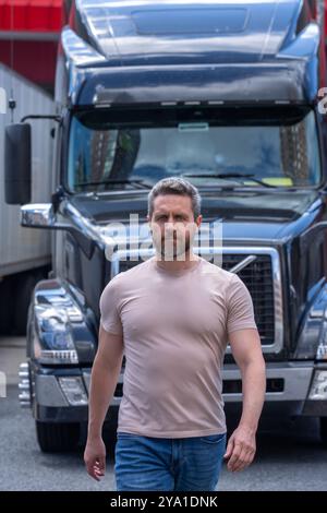 Truck driver. CDL. Portrait of trucker standing by his truck vehicle ...