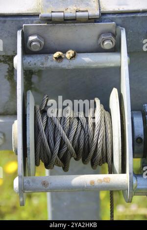 Wire rope from a winch is wound up in a mess Stock Photo - Alamy