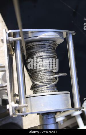Wire rope from a winch is wound up side by side Stock Photo - Alamy