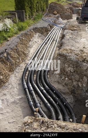 Empty conduits for electricity and water pipes on a construction site ...