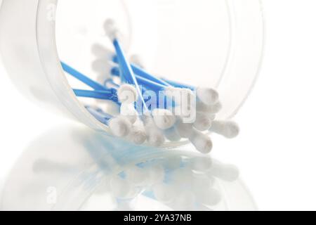Plastic box with cotton swabs on light gray background Stock Photo - Alamy