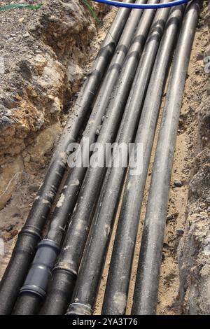 Empty conduits for electricity and water pipes on a construction site ...