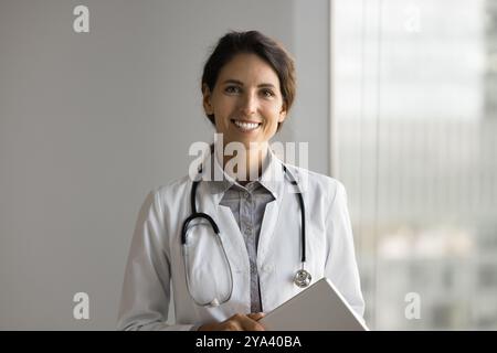Young doctor wearing medical uniform over isolated background shouting ...