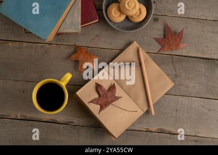 Autumn composition: fallen leaves and notebook mock up on colored ...