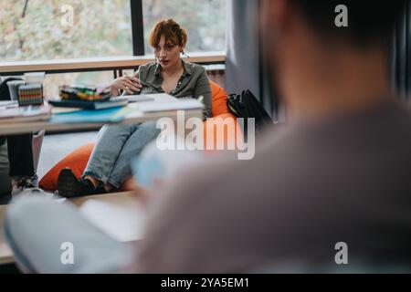 Professor engaging with students in a relaxed classroom setting Stock ...