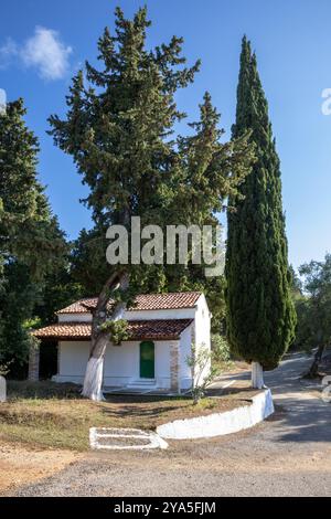 Chapel at a cemetery. Fresh painted white walls and a traditional roof ...