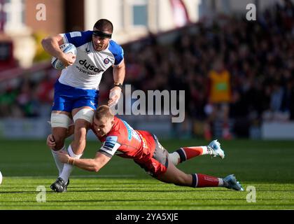 Gloucester's Charlie Atkinson is tackled by Bath's Ruaridh McConnochie ...