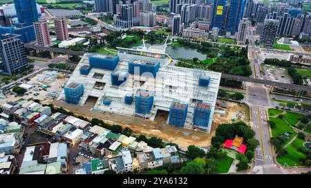 A sprawling urban landscape with modern high-rise buildings and roads ...
